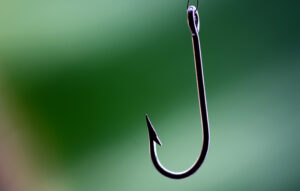 How to Remove a Hook From a Fish Without Injury - Fishing Adventures Guide